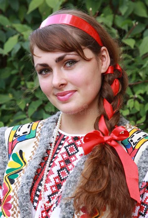 Portrait Of A Romanian Woman Wearing Traditional National Costume
