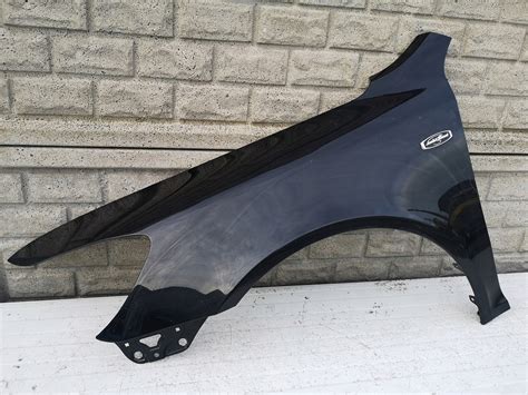 SKODA OCTAVIA II LIFT BŁOTNIK PRZEDNI LEWY oficjalne archiwum Allegro