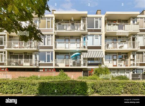 An Apartment Building With Balks On The Balconys And Balks On The Balks