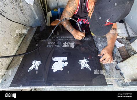A Lapida Maker Working On A Marble Tombstone In Cebu City Philippines