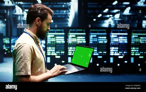 Expert Using Chroma Key Laptop To Check Server Hub Configuration