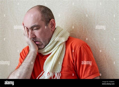 A Sick Man Holds His Hand Over His Head The Patient Has A Headache