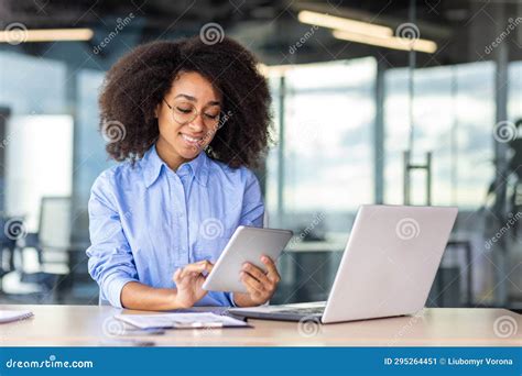 Young Successful Woman Working With Tablet Computer Inside Office At