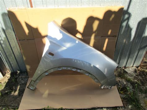 NISSAN QASHQAI J10 07 10 BŁOTNIK PRAWY PRZEDNI KY0 za 310 zł z Łódź