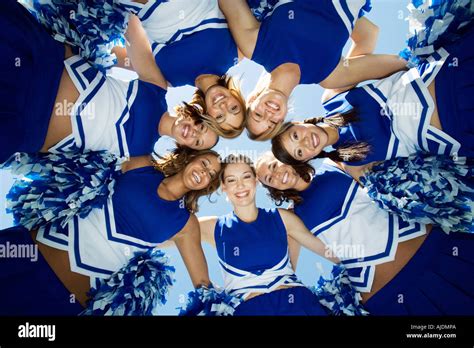 Smiling Cheerleaders Standing In Circle Portrait View From Below