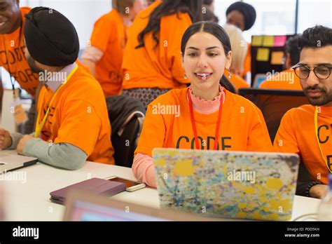 Hackers At Laptop Coding For Charity At Hackathon Stock Photo Alamy