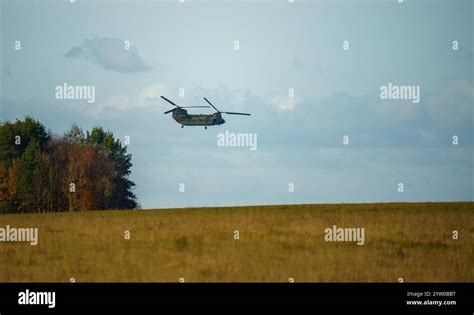 Raf Chinook Tandem Rotor Helicopter Flying Fast And Low On A Military