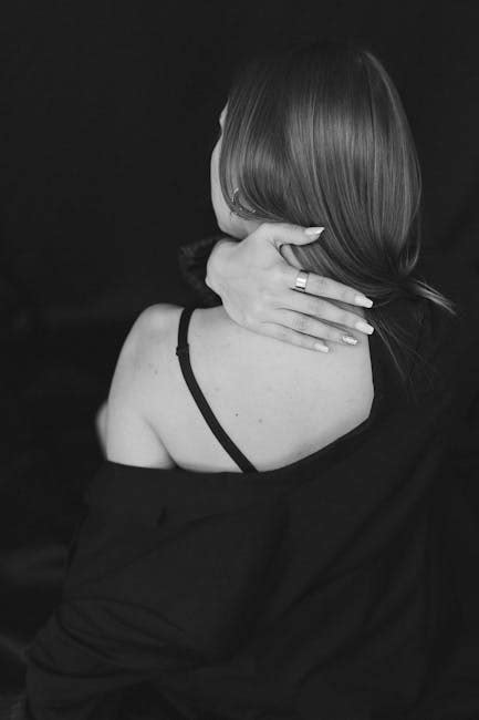 Lady Wearing White Spaghetti Strap Top And Holding Her Brown Short Hair