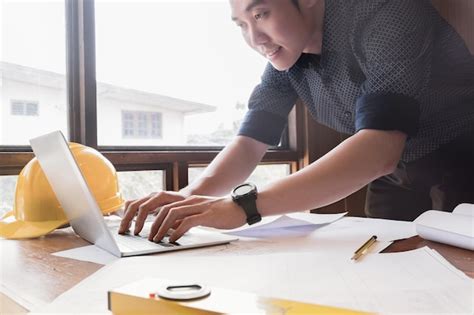 Premium Photo Midsection Of Engineer Working On Table