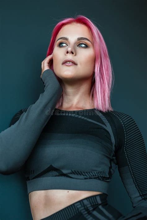 Glamorous Beautiful Young Woman With Pink Hair And A Slender Body In