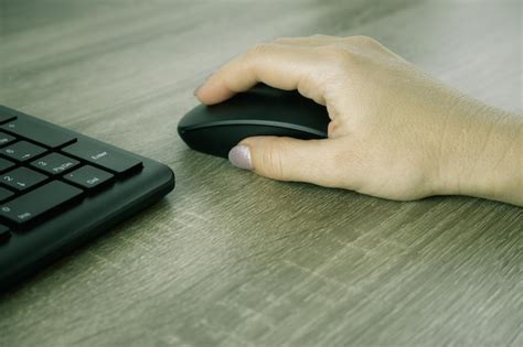 Premium Photo A Womans Hand Works With A Mouse And Keyboard Manipulator Caucasian Woman Using