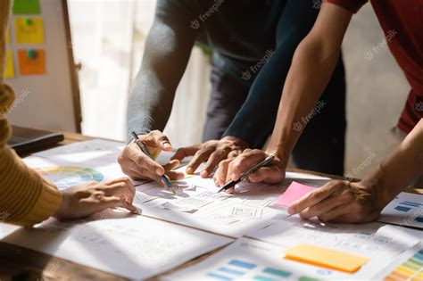 Premium Photo Ux Developer And Ui Designer Brainstorming About Mobile App Interface Wireframe