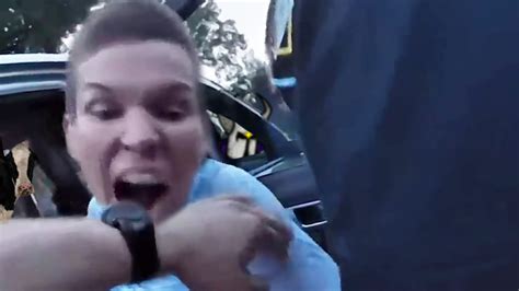 Karen Tries To Bite Officer During Arrest While Kicking And Screaming