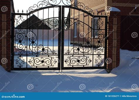 Metal Iron Gates With Decorative Wrought Iron A Ornaments On The Gate