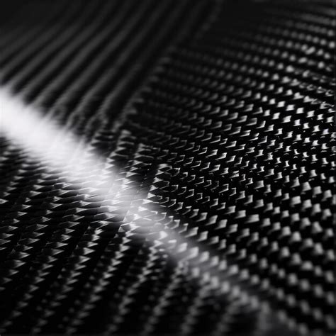 Closeup Of A Black Metallic Surface With A Wavy Ripple Pattern Creating An Abstract Texture