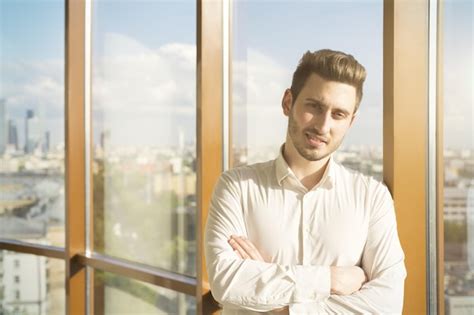 Premium Photo Young Guy Against Window