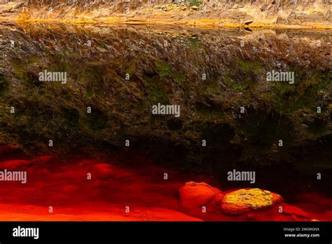 The Dramatic Red Sediments Of Rio Tinto Contrast Sharply With The Dark