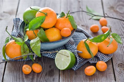 Download Kumquat Fruit With Limes And Oranges Wallpaper | Wallpapers.com