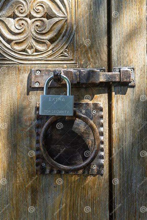 Old Deadbolt On A Carved Wooden Door Copper Door Knob And A Modern