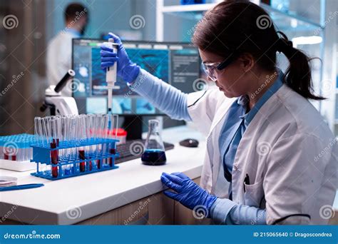 Scientist Looking Into Micropipette For Biology Test Stock Photo Image Of Genetic Technology