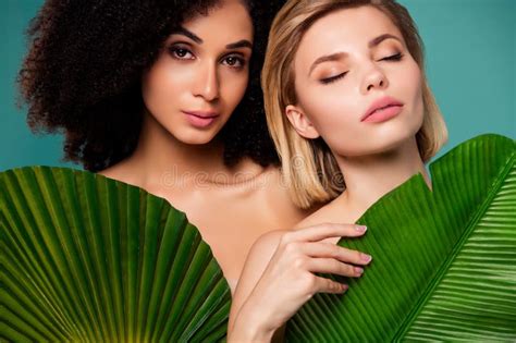 Close Up Photo Of Two People Girls Cover Body With Green Leaves Feel