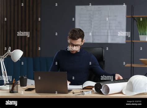 Architect Working In Office With Blueprintsengineer Inspect Architectural Plan Sketching A