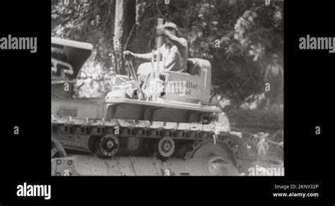 1940s Shots Of Equipment Pulling Log Log Lifted By Pulley Man