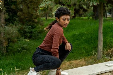 Premium Photo A Multiracial Indian Woman In A Park Posing Model Brown