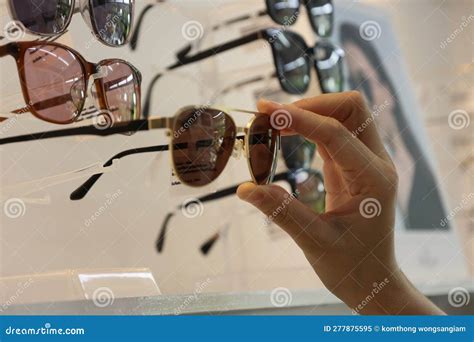 Hand Holding Glasses In Eyeglasses Shop Glasses In Female Hand Stock