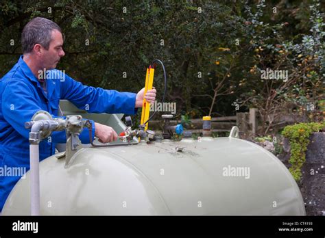 Gas Engineer Testing Tank Pressure Stock Photo Alamy