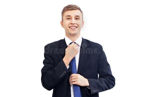 Young Attractive Serious Business Man Straightens Bright Blue Tie