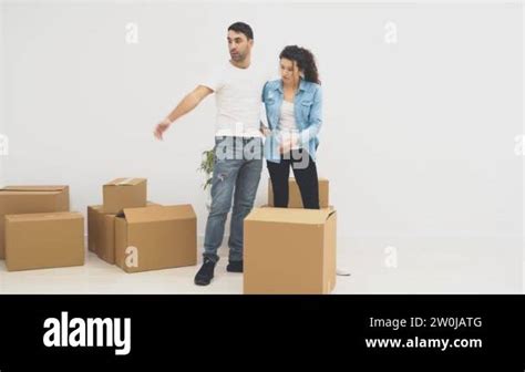 Young Couple Is Moving To A New Apartment Together They Are Thinking