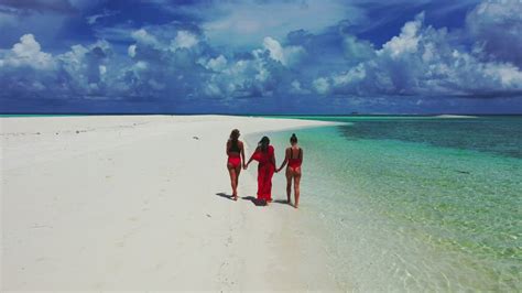 Beautiful Beauty Models On Holiday Spending Quality Time At The Beach