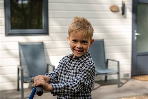 Premium Photo A Boy Standing In A Wagon