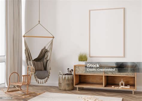 현대 어린이 방의 흰색 벽에 빈 수직 액자 스칸디나비아 양식의 인테리어를 모의하십시오 무료 사진을위한 공간을 복사하십시오 등나무 세부 사항 아이들을위한 아늑한 방 3d