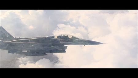 A Fighter Jet Is Flying Through The Clouds