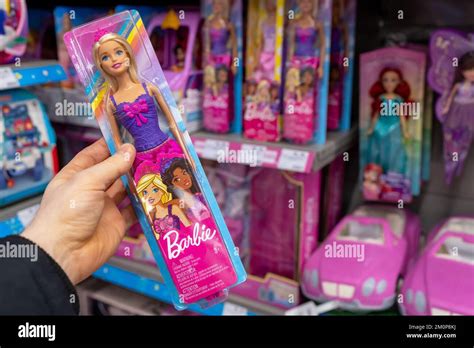 Barbie Doll In The Hand Of A Customer In A Toy Store Barbie Is A