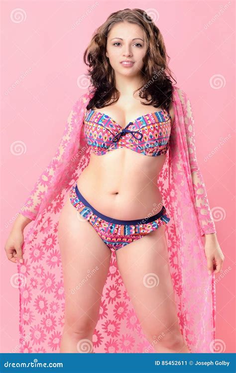 Beautiful Curvy Young Woman Wearing Colorful Bikini With Gown On Pink