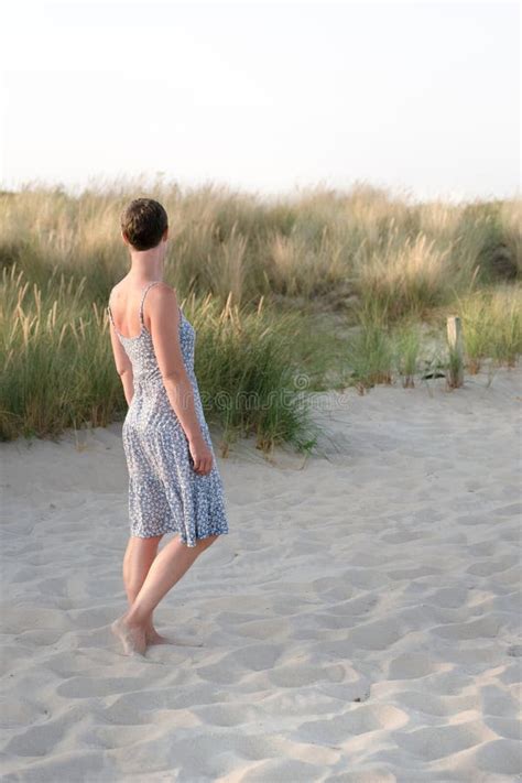 Attractive Short Haired Woman In Her Thirties Dressed In Light Summer