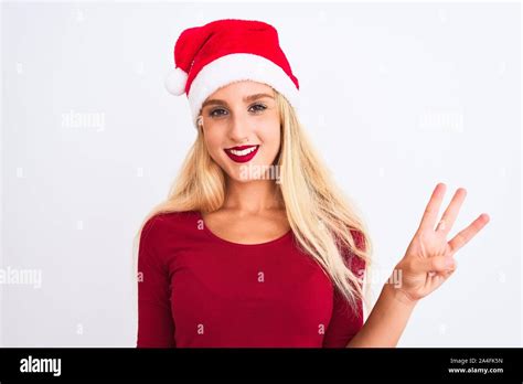 Young Beautiful Woman Wearing Christmas Santa Hat Over Isolated White
