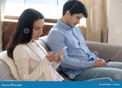 Young Couple Addicted To Cellphones On Weekend At Home Stock Image Image Of Cellular Person