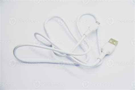 White Usb Cable For Charging The Phone On A White Background White Cord For Charging Gadgets