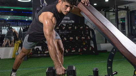The 10 Best Dumbbell Exercises To Hit Your Lats Breaking Muscle In