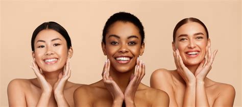 Premium Photo Three Women Touching Face Caring For Skin On Gray