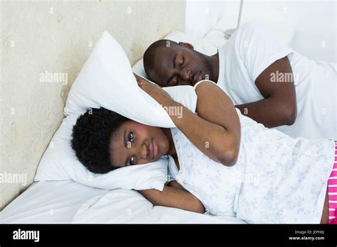 Pregnant Woman Covering Her Ears Stock Photo Alamy