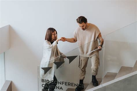 Confident Adults Collaborating On A Project In A Modern Office Discussing Business Solutions