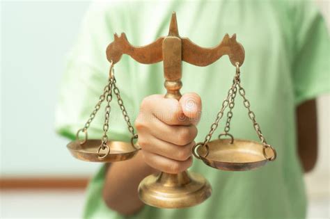 Balancing The Weight Justice The Hand Holds The Symbolic Legal Scales
