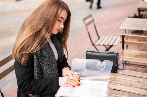 Premium Photo Woman With Documents Outside