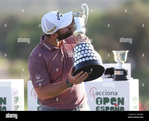Spanish Player Jon Rahm Lifts The Trophy At The Prize Giving Ceremony