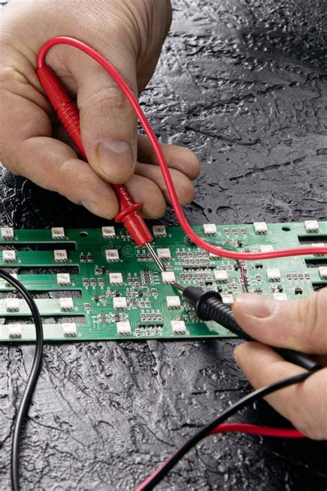 The Master Tests The Leds On The Microcircuit Using A Multi Meter
